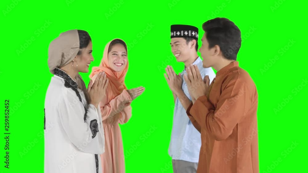 Group of happy young muslim people wearing islamic clothes and ...