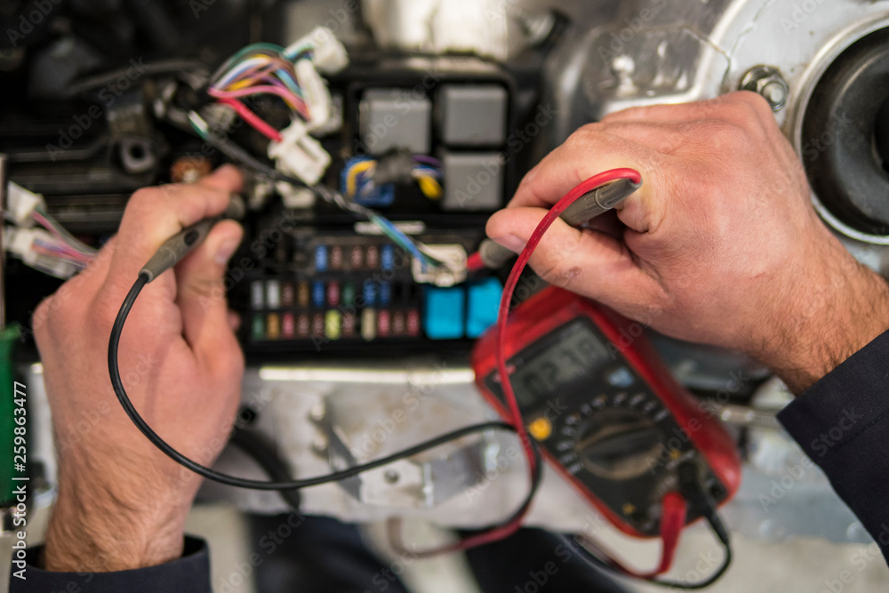 car electrician repairs car, tester and fuses and nippers Stock Photo ...
