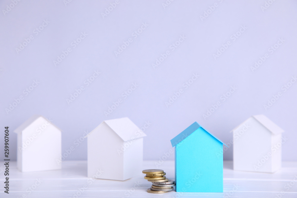 Paper town. Papercraft house and papercraft building with coin Photos ...