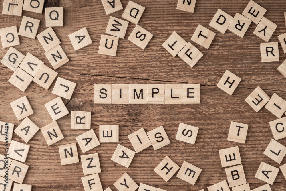 the word simple written with wooden letters Stock Photo | Adobe Stock