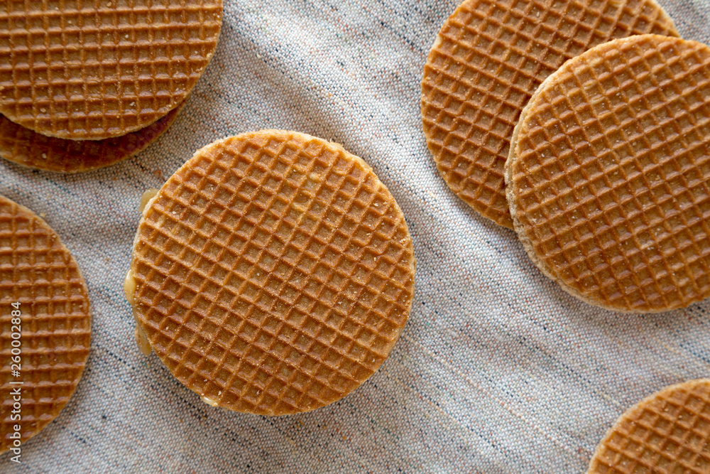Sweet homemade Dutch stroopwafels with honey-caramel filling on cloth ...