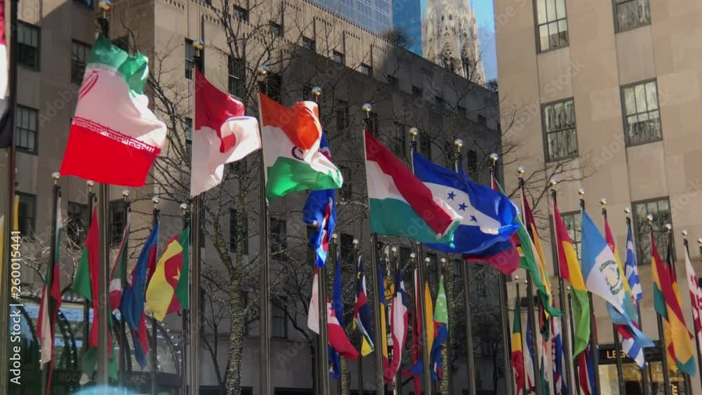 International flags from around the world. Pan line of flags blowing in ...