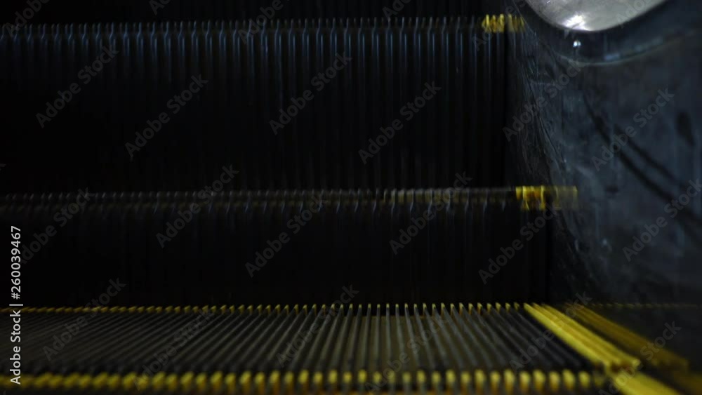 Escalator. Moving staircase in business center. Laziness. Moving steps ...