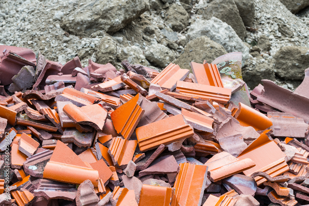 Cracked roof tile. Rubble heap. Building waste dump detail. Pile of ...