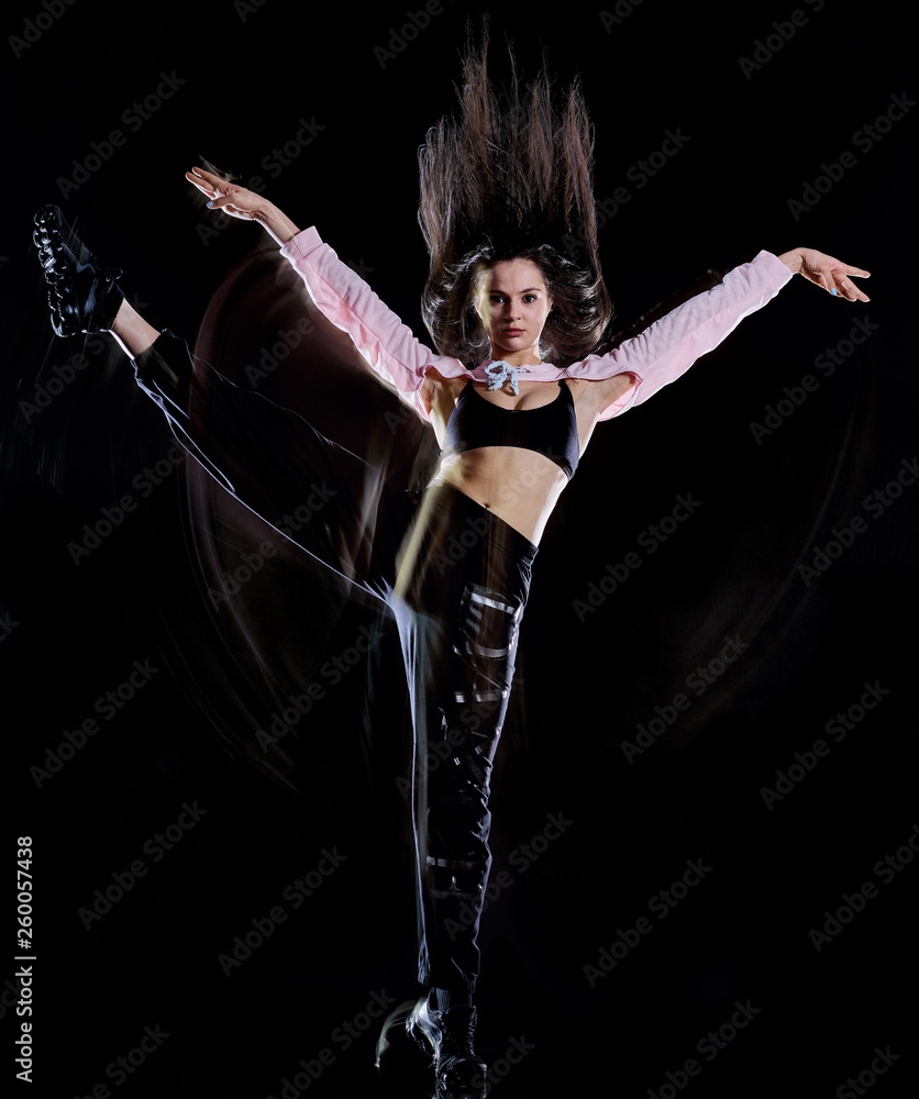 one caucasian young woman modern dancer dancing isolated on black ...