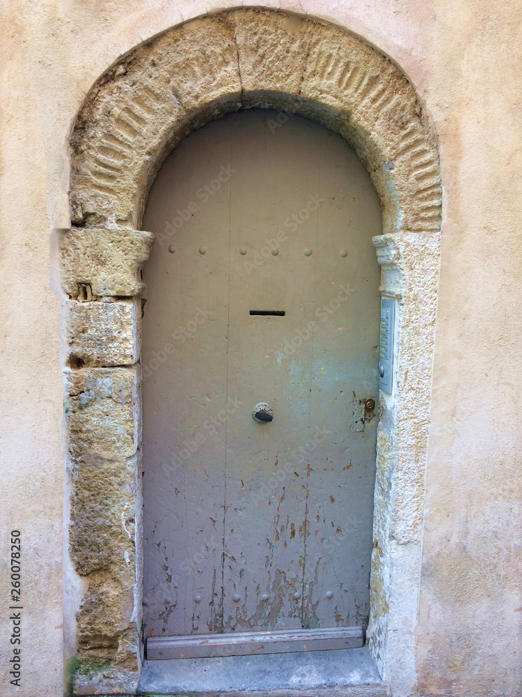 ancient door with carved stones and arch Stock Photo | Adobe Stock