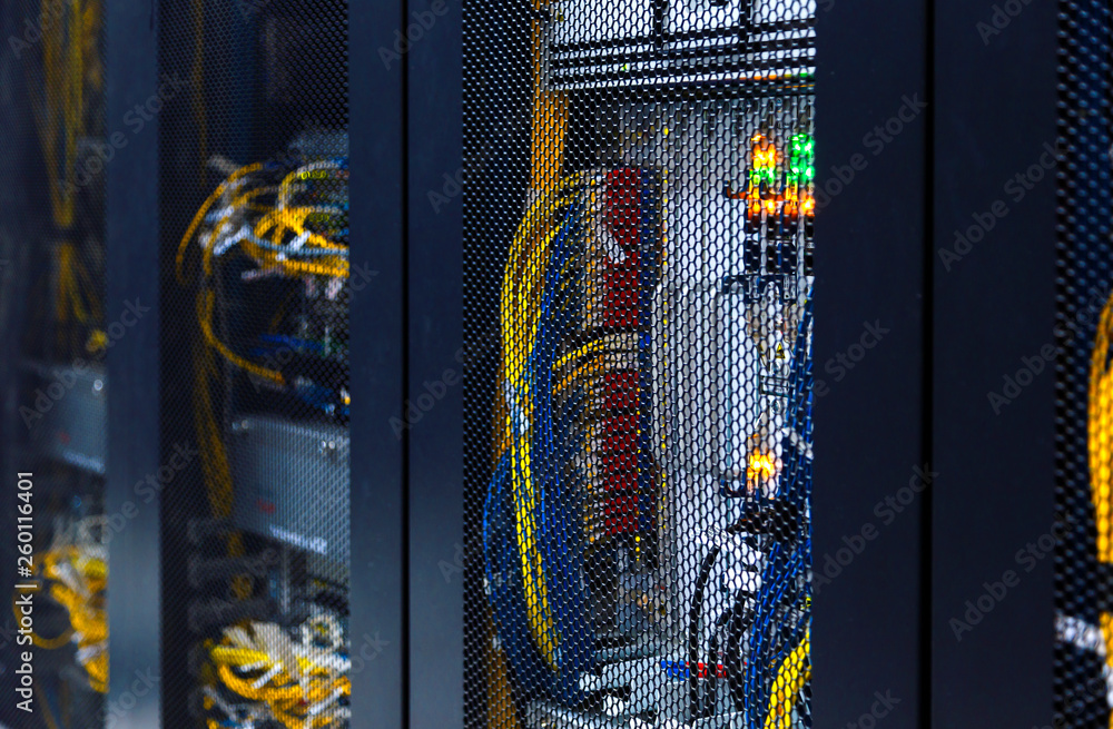 Close up modern interior of server room with super computer, wires and ...