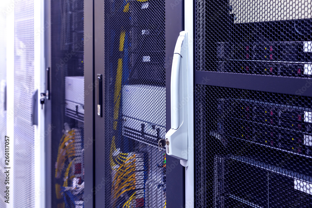 Row of racks in big data center inside close up. Datacentre interface ...