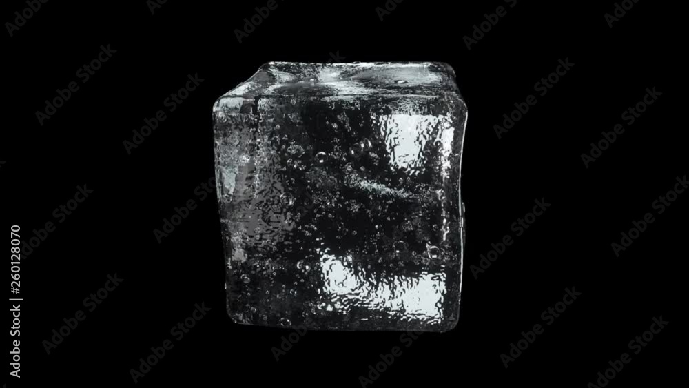 Detailed ice cube close up rotates on black isolated background. 4k ...