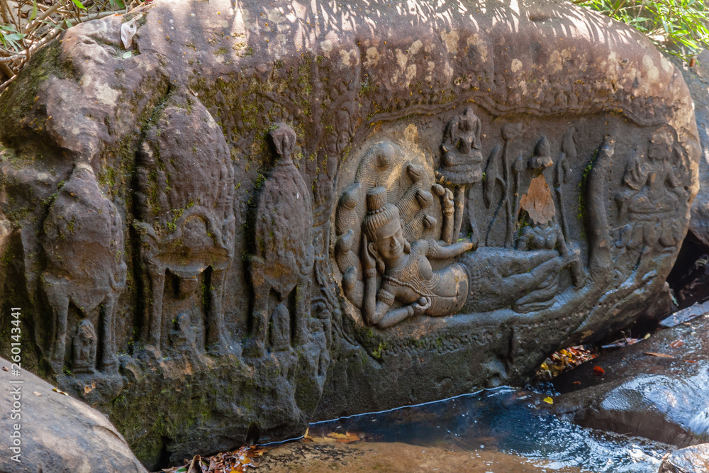 Lord Vishnu in a reclining repose lying on the serpent god Ananta, with ...