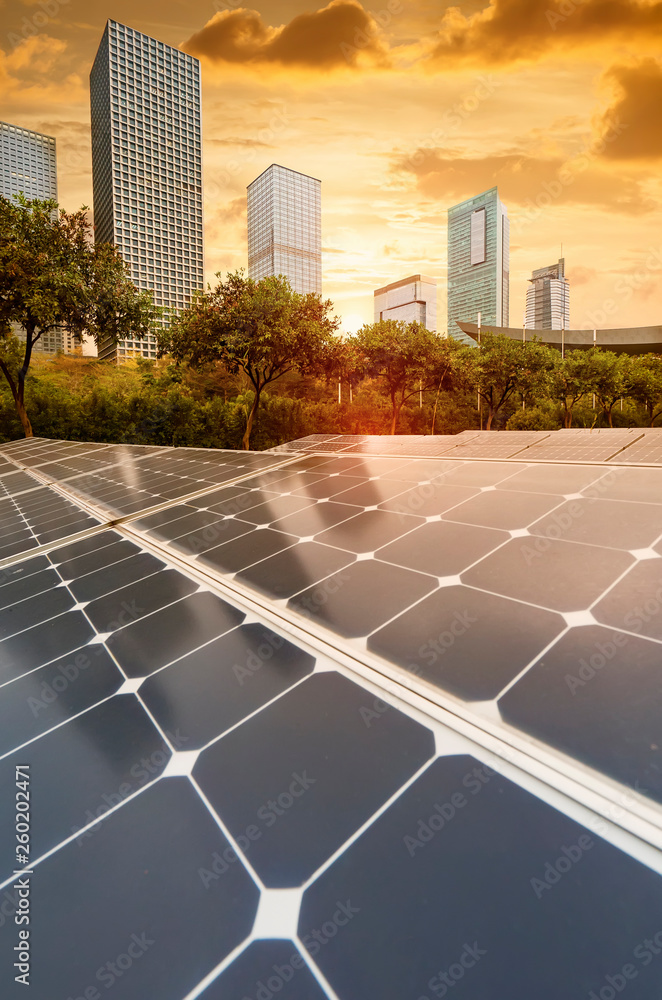 Ecological energy renewable solar panel plant with urban landscape ...