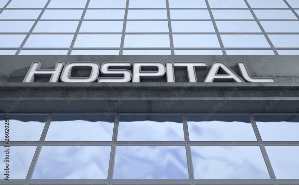 Signage above the entrance to a modern generic hospital building made ...
