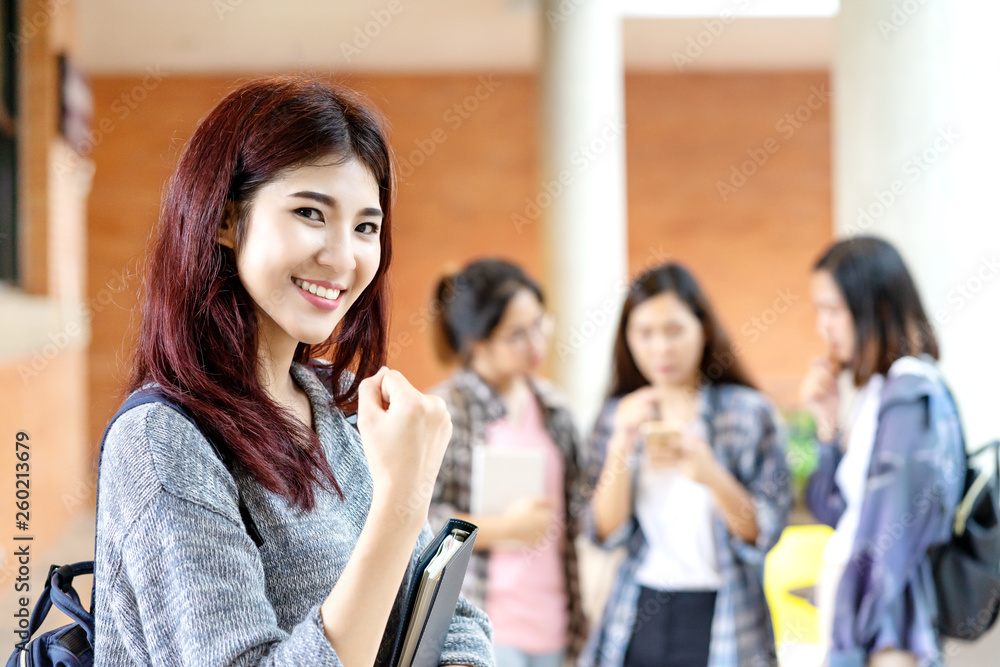 Young happy attractive asian student smiling to camera expression ...
