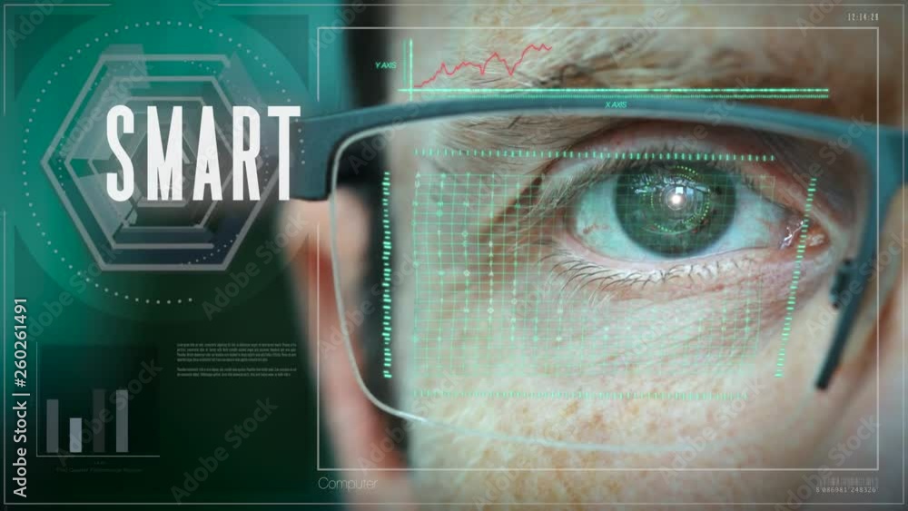 A close up of a businessman eye controlling a futuristic computer ...