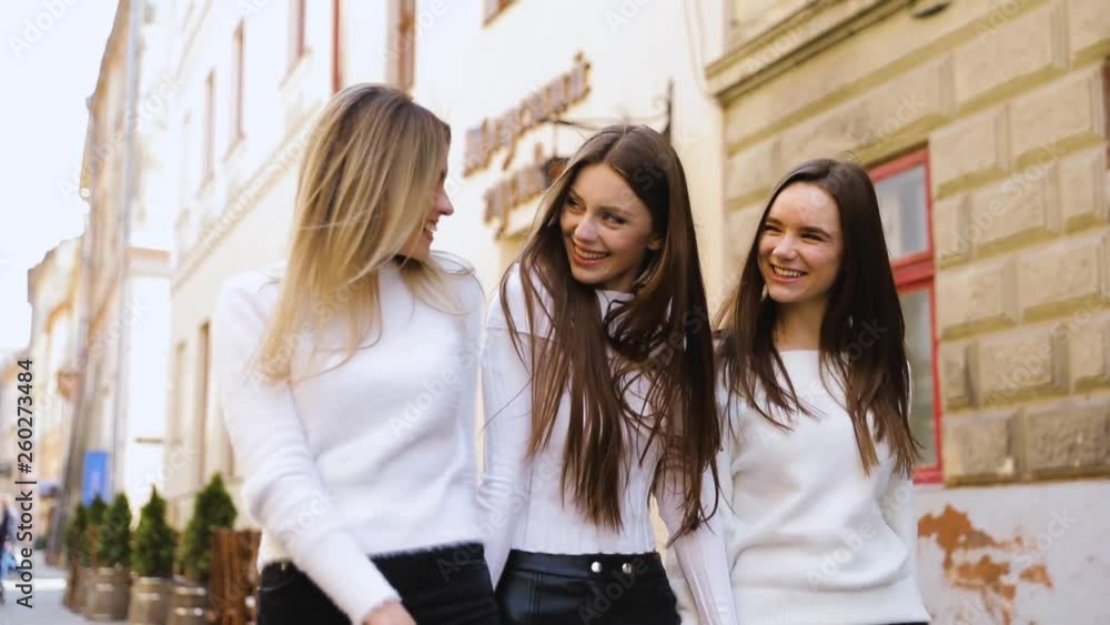Group of young female friends hanging out in the city. Multiracial ...