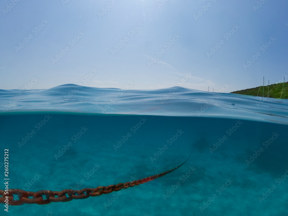 Underwater view of an anchor chain of a ship. Stock Photo | Adobe Stock