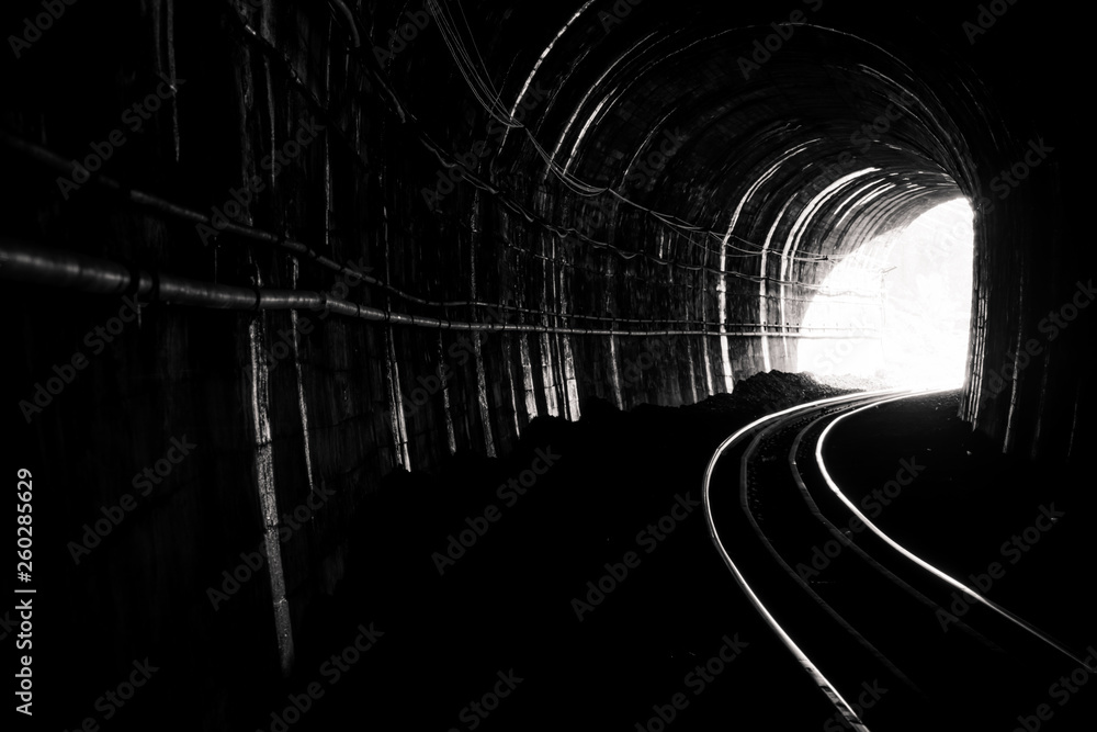 Train tunnel. Old railway in cave. Hope of life in the end of the way ...