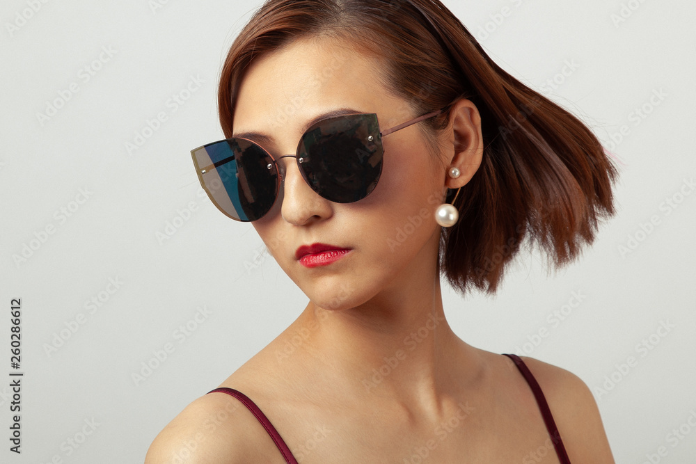 Chinese Girl wearing varies types of fashion sunglasses,looking sharp ...