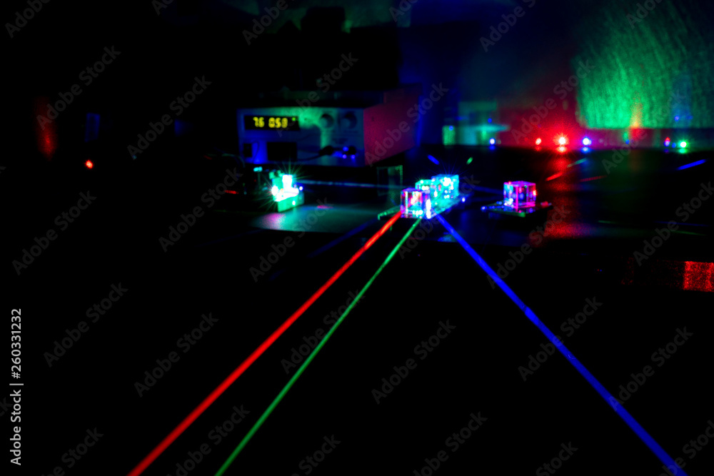 Laser beams in the laboratory of optical physics Stock Photo | Adobe Stock