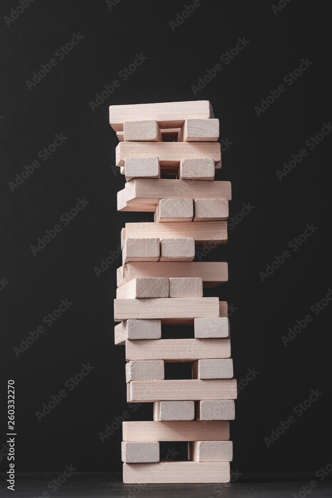 Business idea implementation. Tower stack. Wooden blocks construction ...