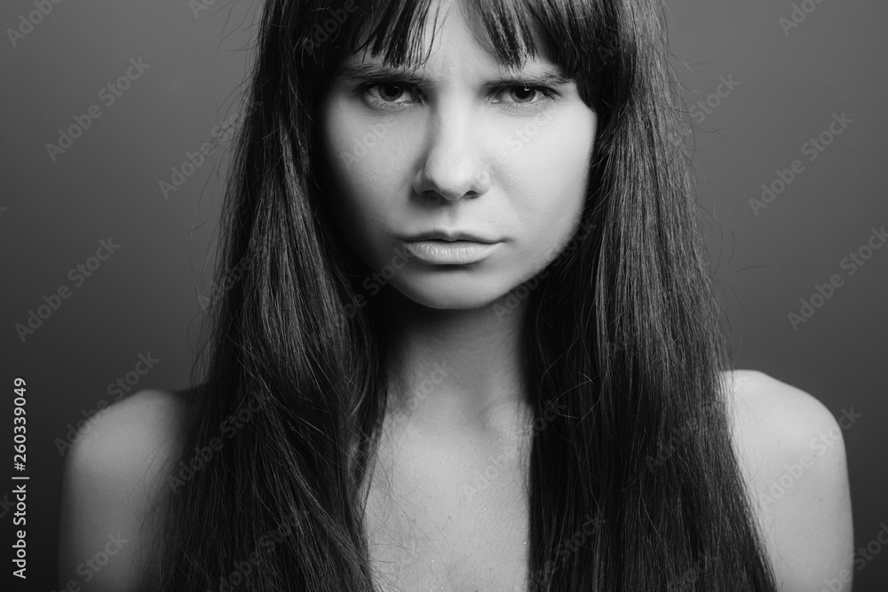 Distrustful looking beautiful girl. Insecure facial expression. Black ...