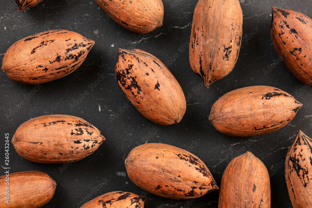 Overhead shot, whole pecan nuts in shell on black board. Stock Photo ...