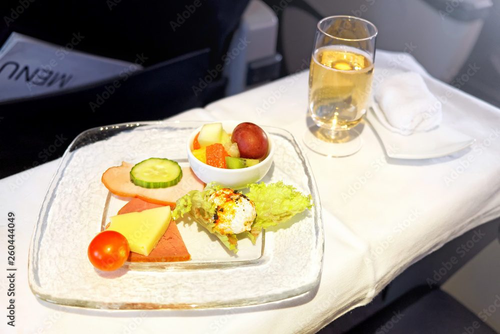 airplane food in business class interior with champagne wine drink ...