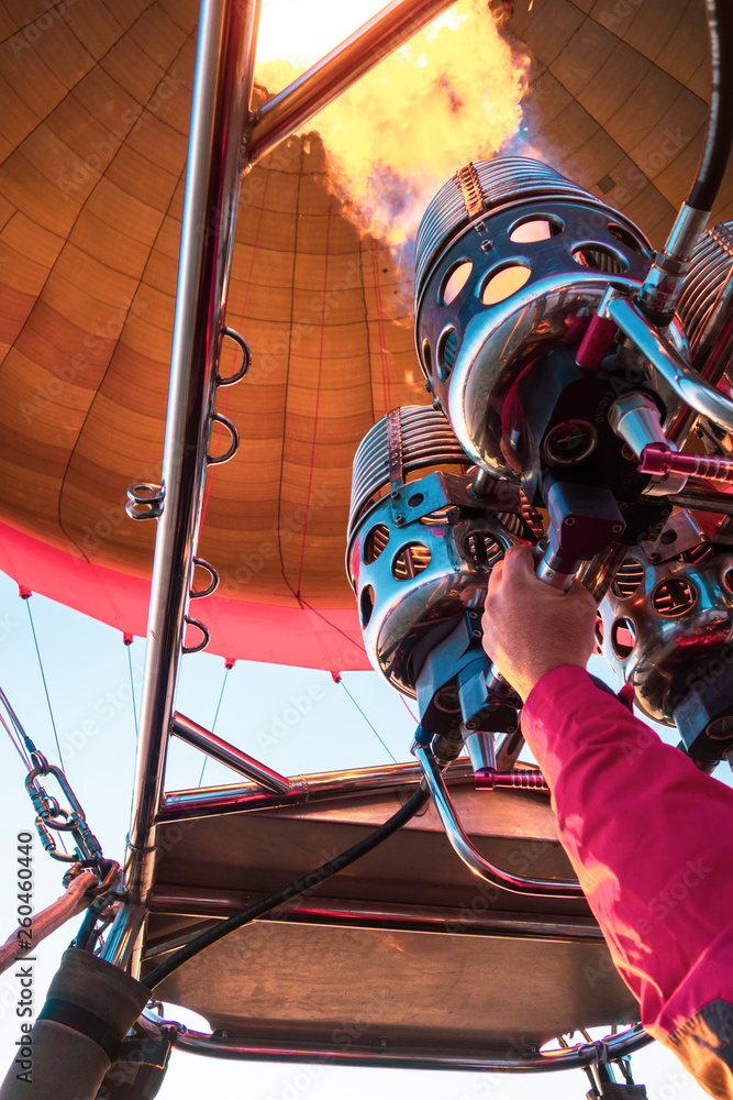 Hot air balloon flight. Close up view inside the dome of aerostat. Hand ...