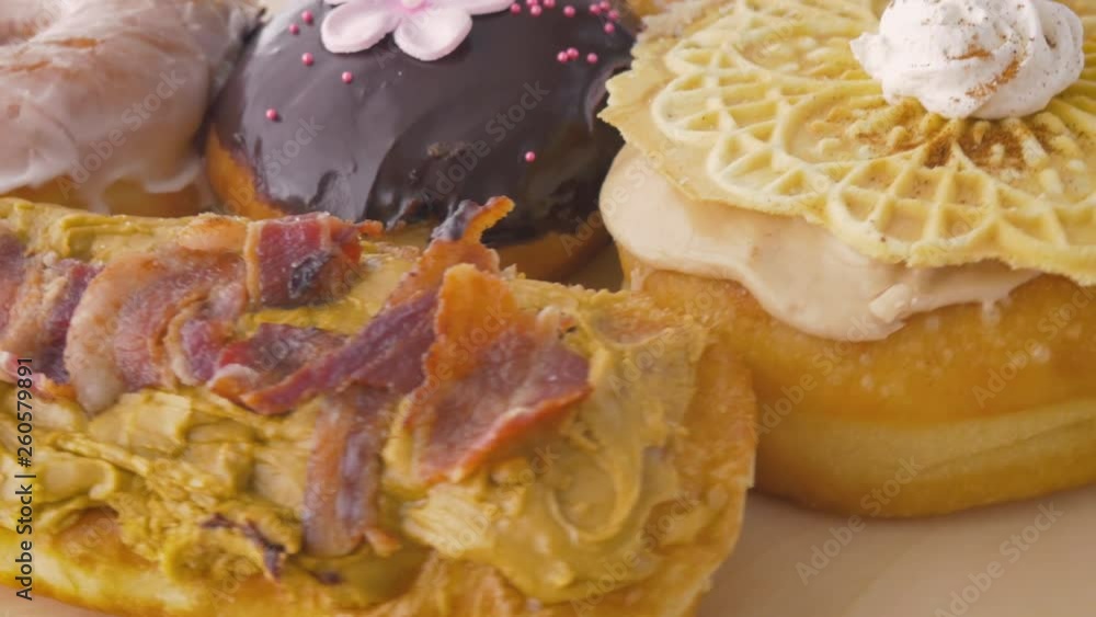 Celebrating National Donut Day with an assortment of doughnuts in 4k ...