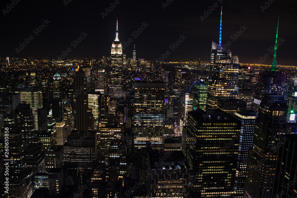 Night time aerial view of Manhattan in New York City showing the ...