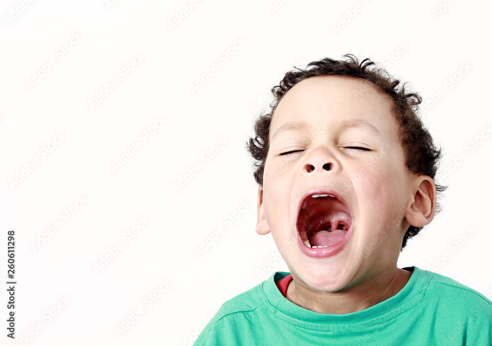 little boy yawning with open mouth on grey background stock photo Stock ...