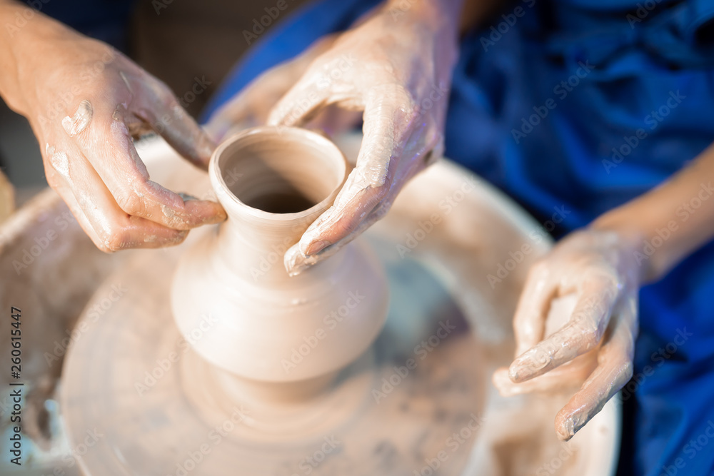 Traditional pottery making, man teacher shows the basics of pottery in ...