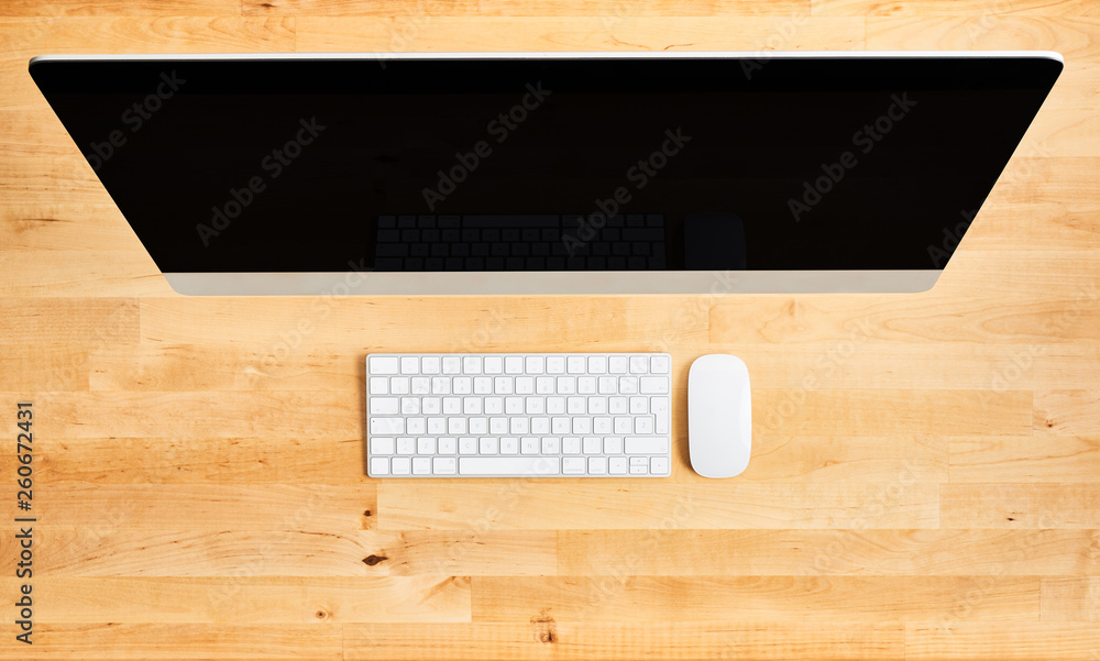 Desktop computer top view. Top view of wooden office desk with large ...