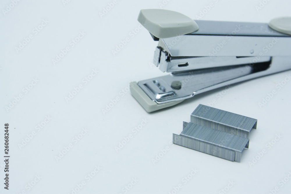 Stapler and staple on plain white background Stock Photo | Adobe Stock
