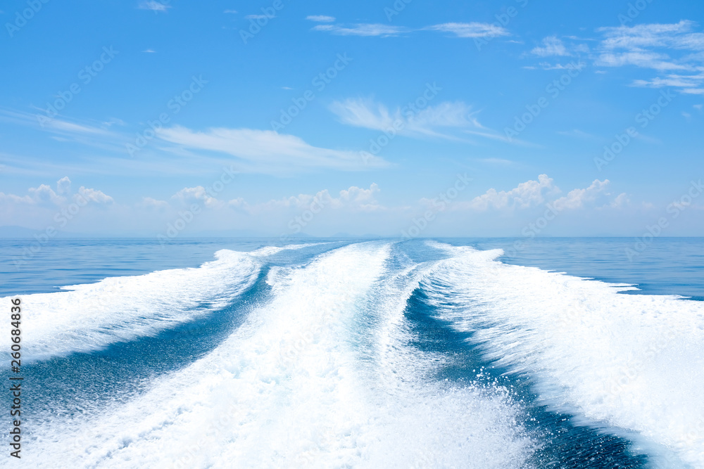 Sea wake trail behind a speed boat with waves, foam, bubbles on the ...