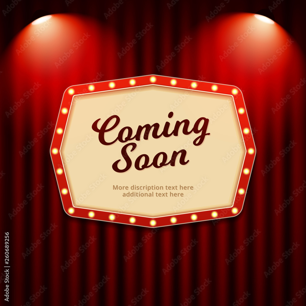 Coming soon retro billboard sign illuminated by spotlights on theater ...