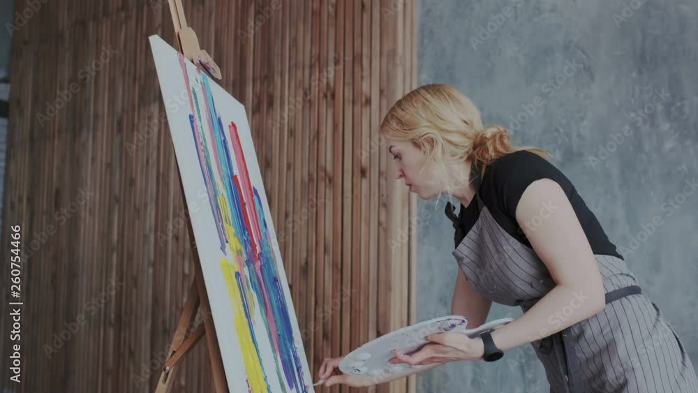 Drawing process: talented skilled blonde female painter create modern ...