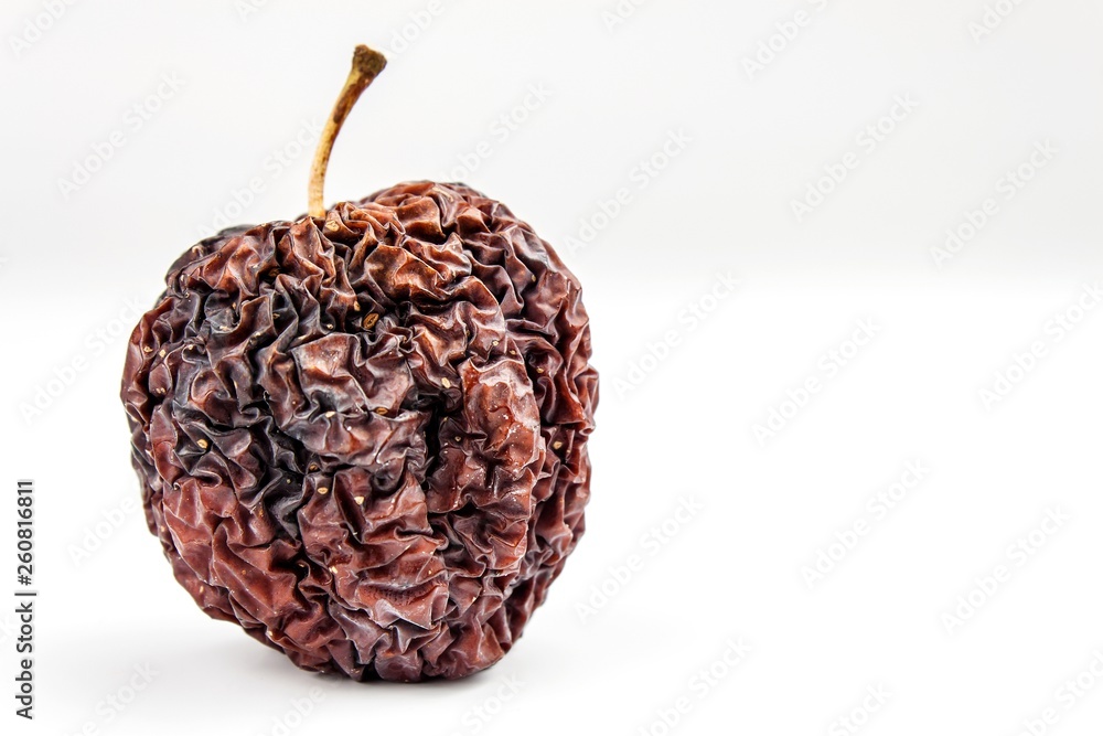 Wrinkled apple texture with white background. Shriveled apple. Old ...