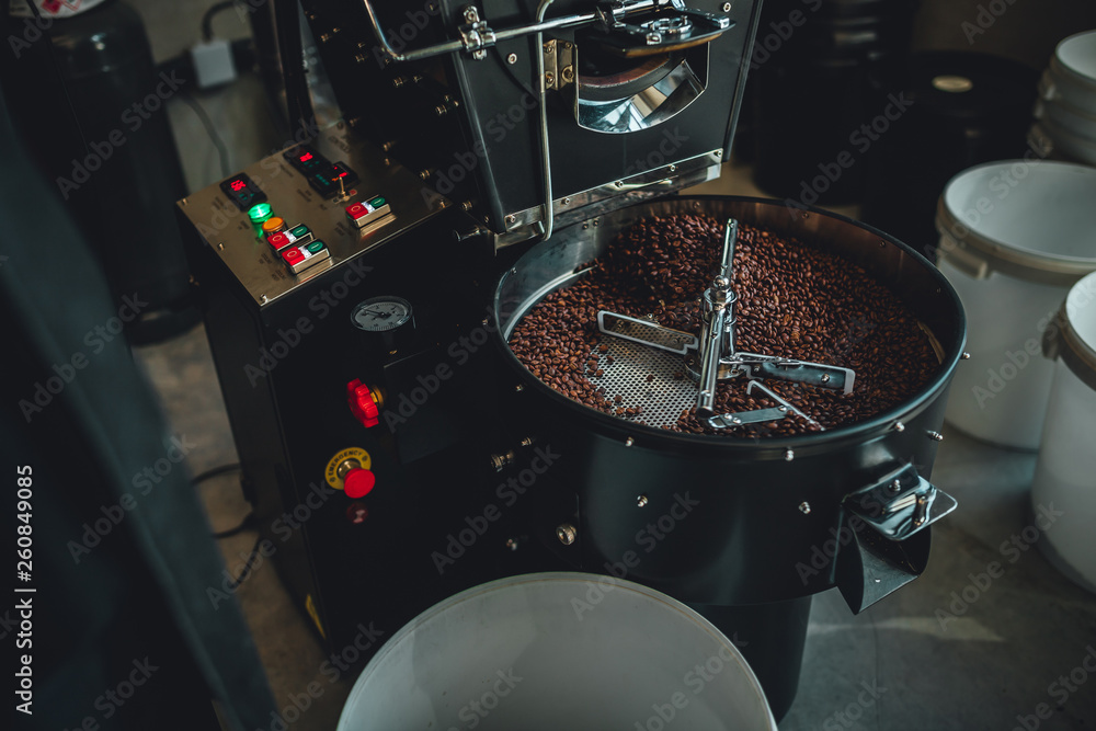Coffee roasting in small roastery. Coffee roasting machine, Production ...