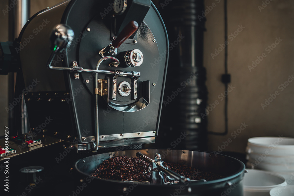 Coffee roasting in small roastery. Coffee roasting machine, Production ...