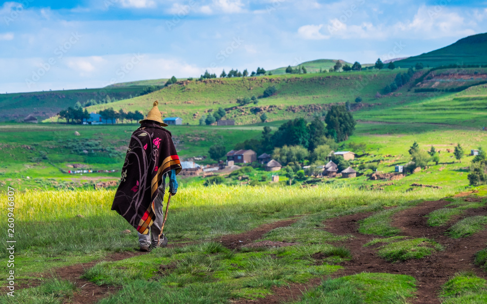 Basotho man with basotho blanket and basotho hat walking in the ...