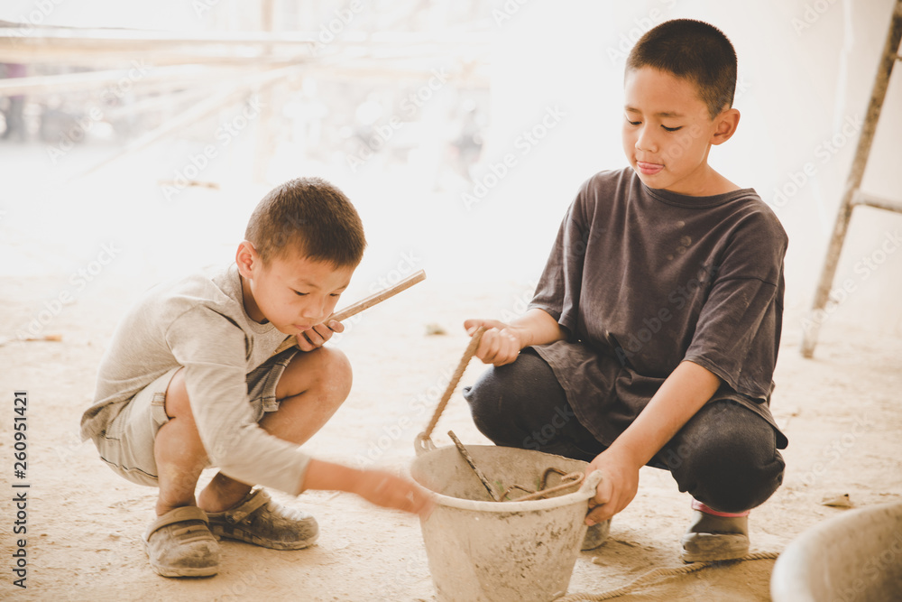 Little Child labor working in commercial building structure, World Day ...