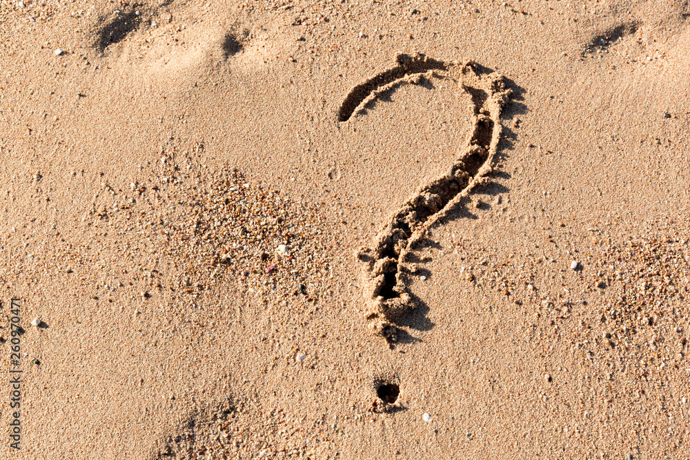Question mark sign on sand beach near the sea. Concept of dilemma ...