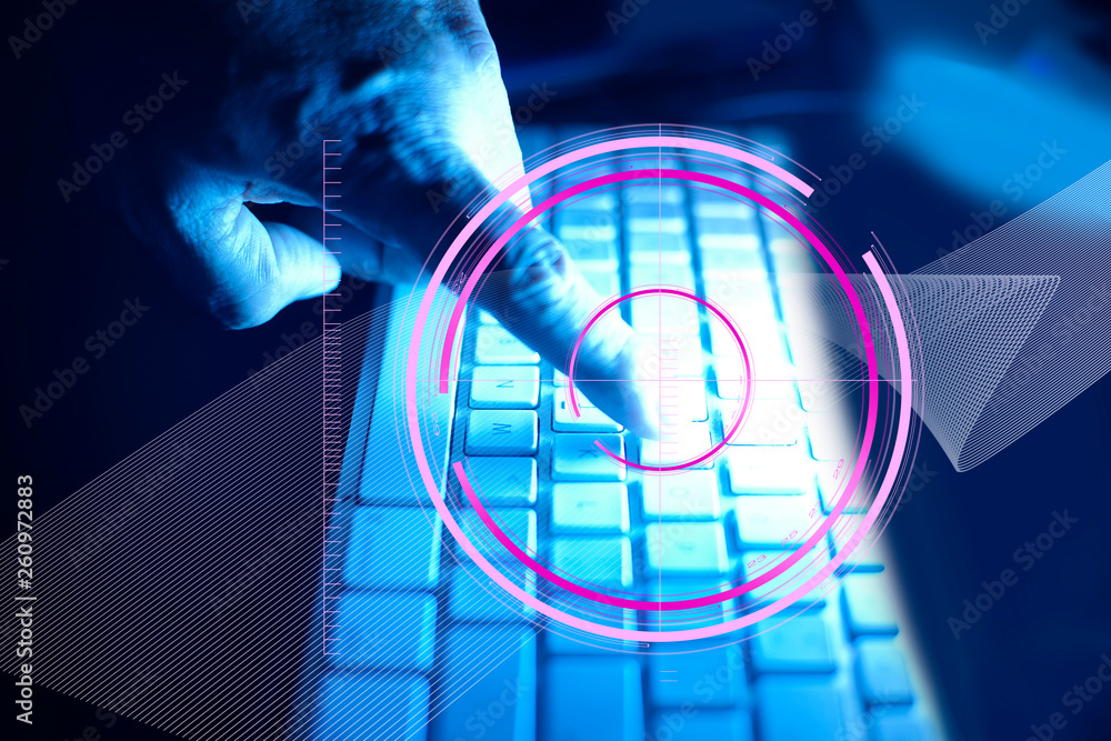 The index finger touches the computer keyboard with the global network ...