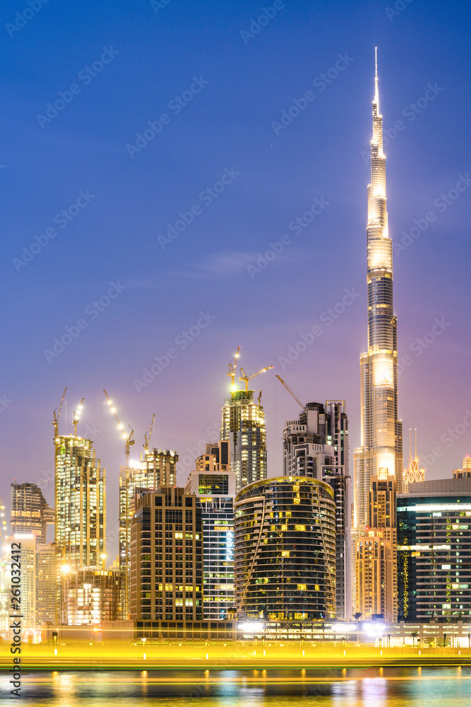 Stunning view of the illuminated Dubai skyline during sunset with the ...