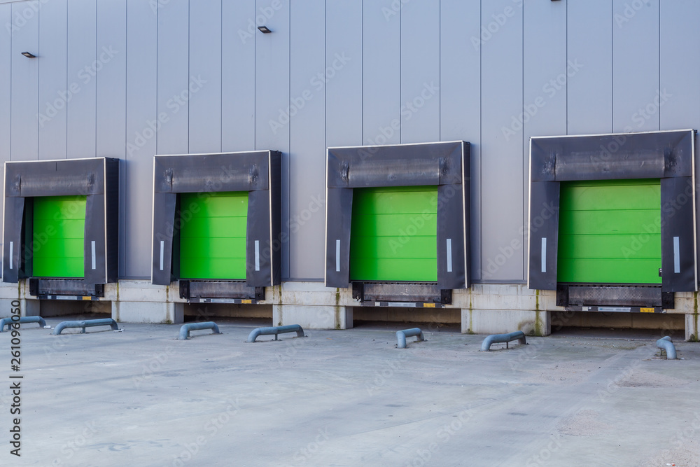 Green loading ramp doors at distribution center Stock Photo | Adobe Stock
