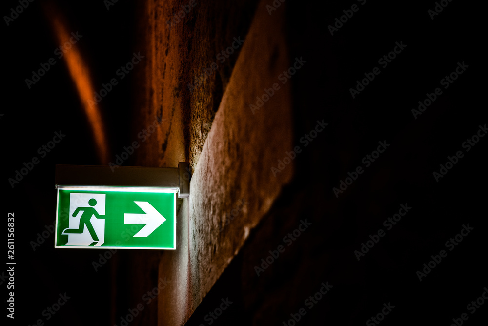 Emergency exit sign illuminated with dark background. Stock Photo ...