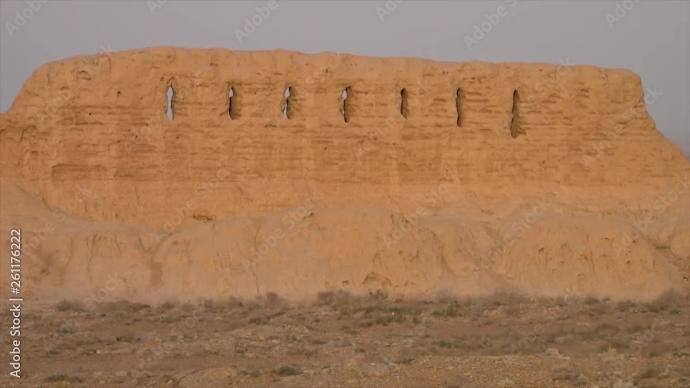 Vidéo Stock A wide, still shot of the ruins of an ancient orange, clay ...