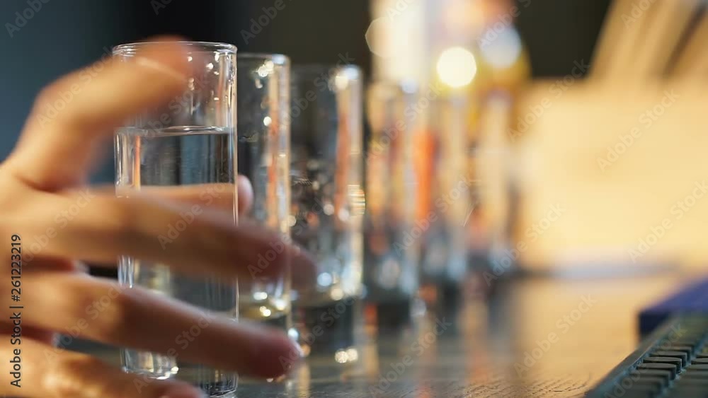 Female drinking alcohol shots on bar counter, party at night club ...