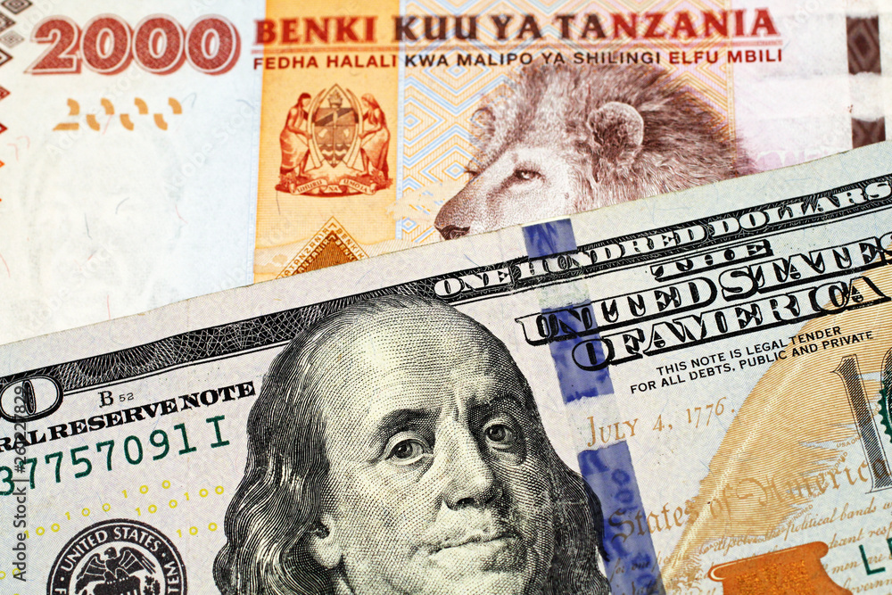 An orange and blue two thousand Tanzanian shilling bank note with a ...